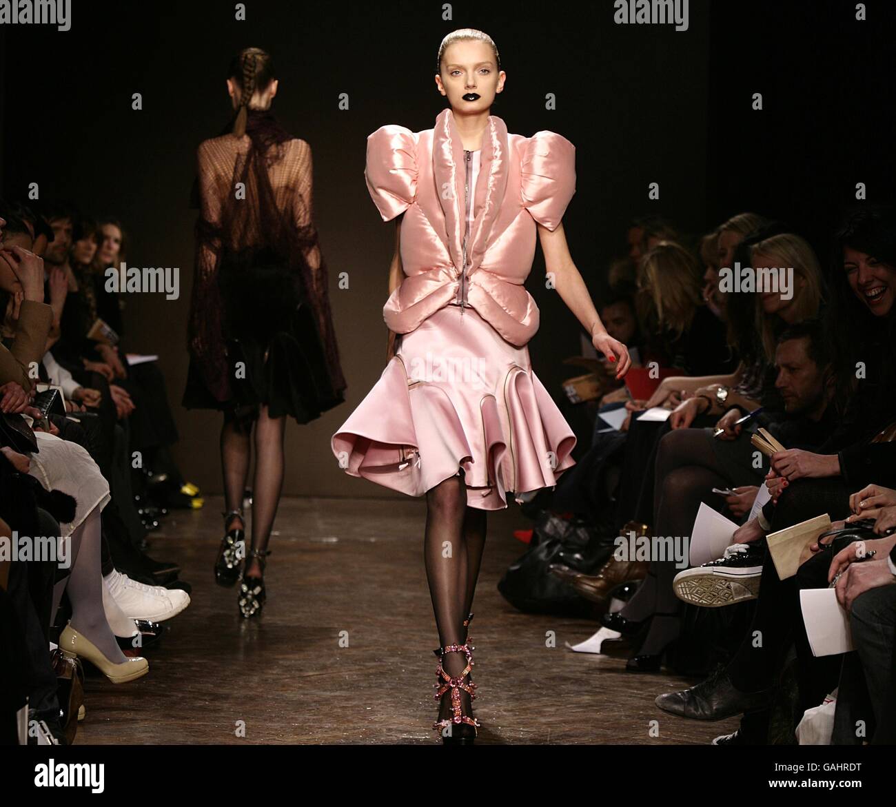 London Fashion Week - Giles Catwalk Show. A model wears a creation by ...