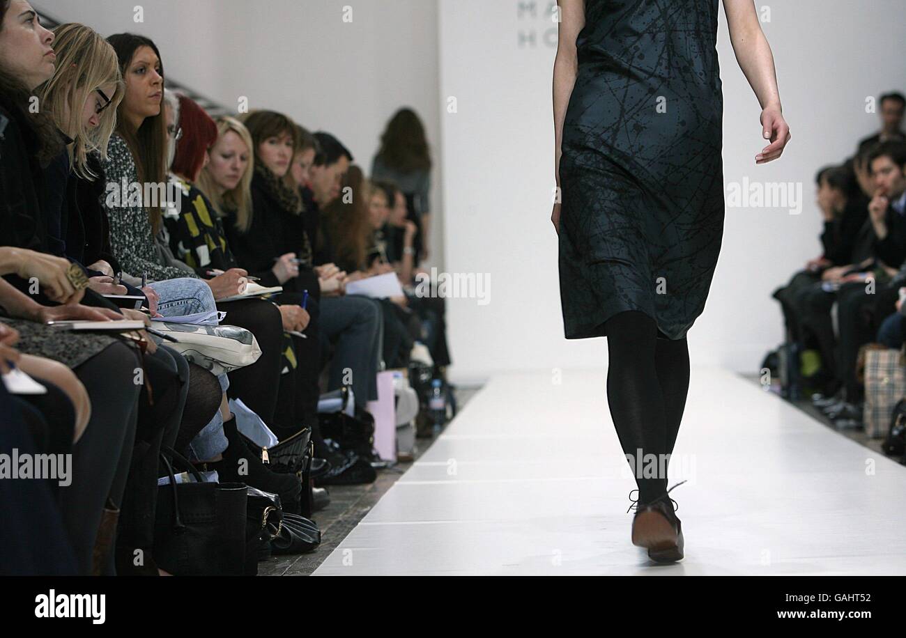 A model wears a creation by designer Margaret Howell, during London ...