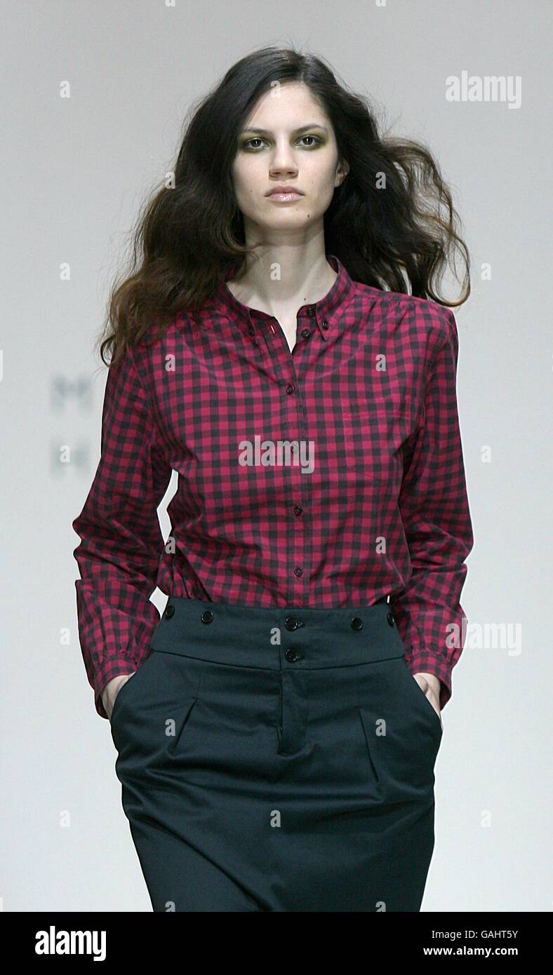 A model wears a creation by designer Margaret Howell, during London ...