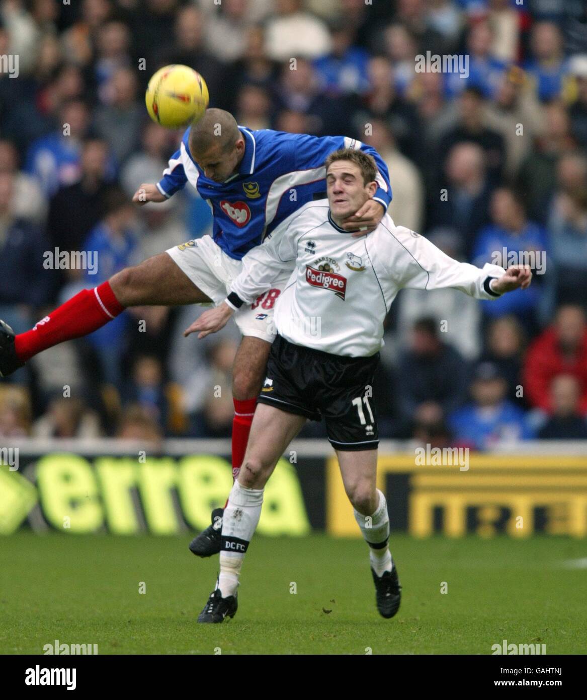 Portsmouth's Paul Ritchie wins a header against Derby County's Lee ...