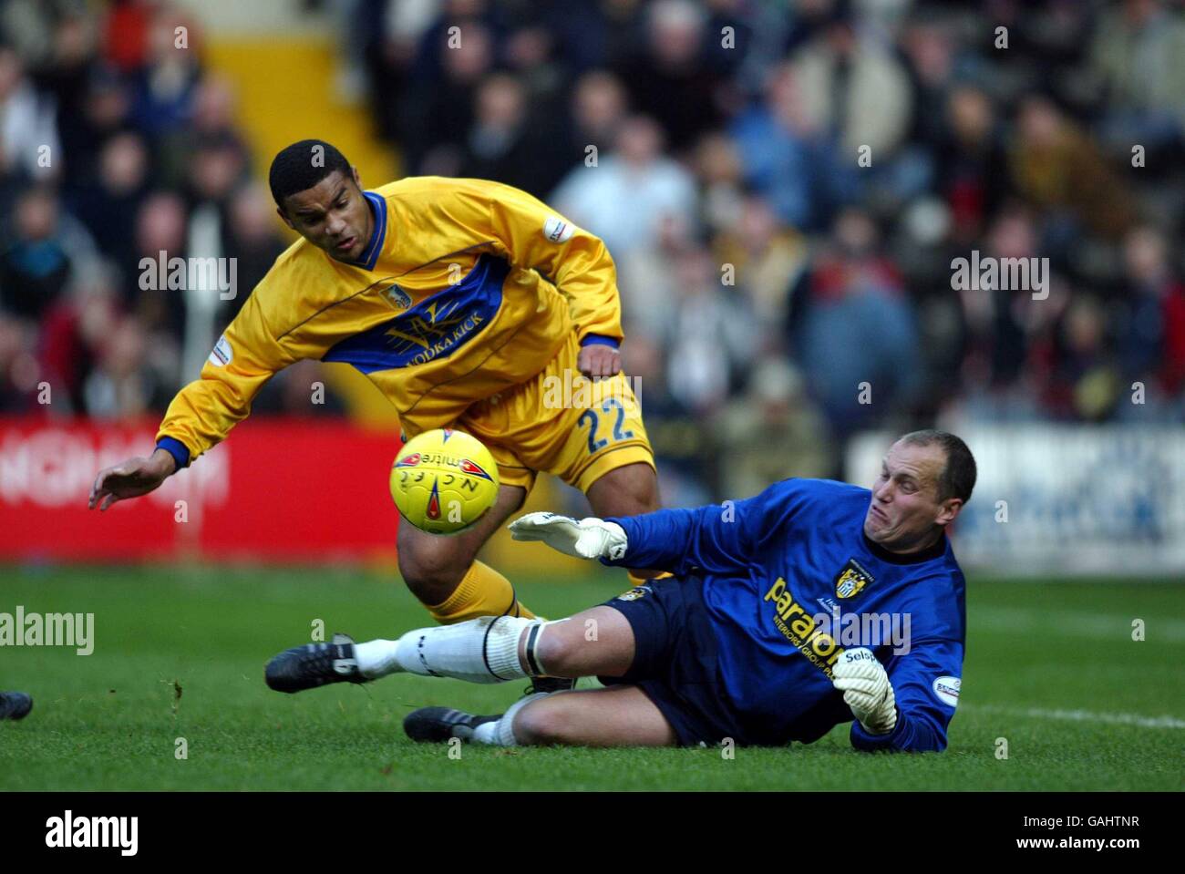 Notts County's goalkeeper Stuart Garden and Mansfield Town's Iyseden ...
