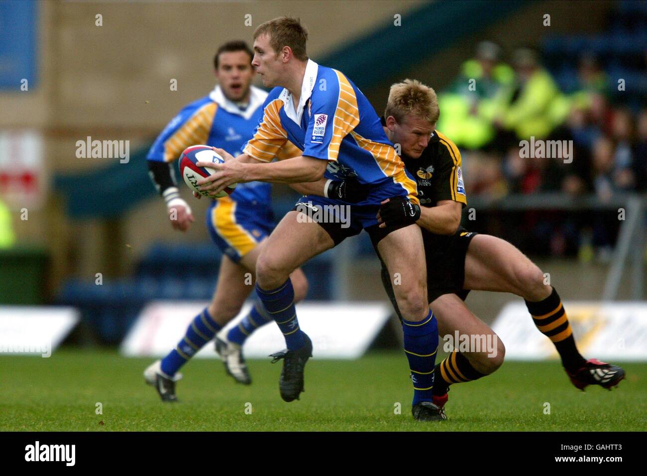London waspsjosh lewsey tackles leeds tykes chris hall hi-res stock ...