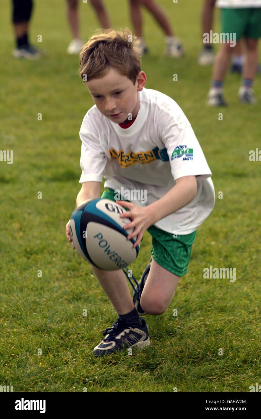 A young rugby player practices his skills at the launch of the Powergen ...