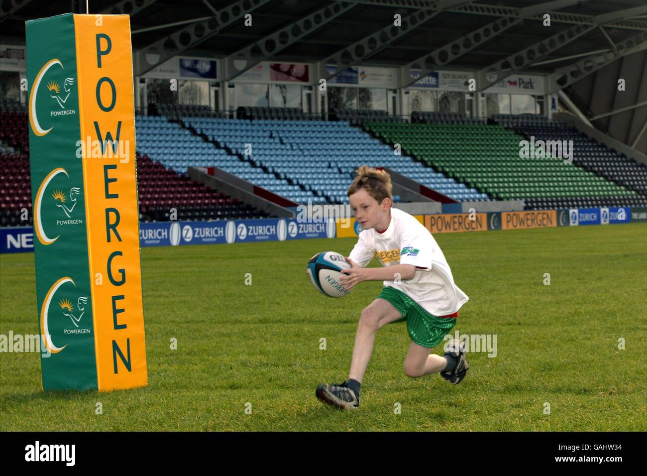 A young rugby player practices his skills at the launch of the Powergen ...