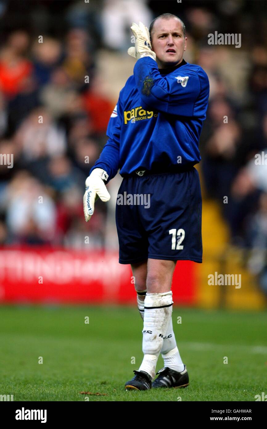 Notts County's goalkeeper Stuart Garden listens to instructions from ...