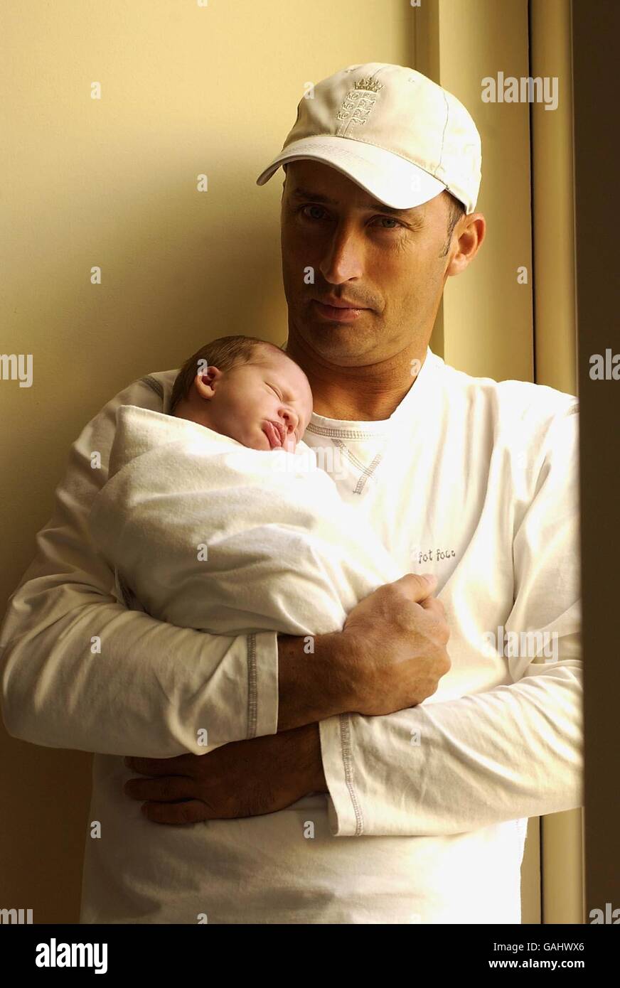 England's captain Nasser Hussain with his new baby Joel in Perth Stock ...