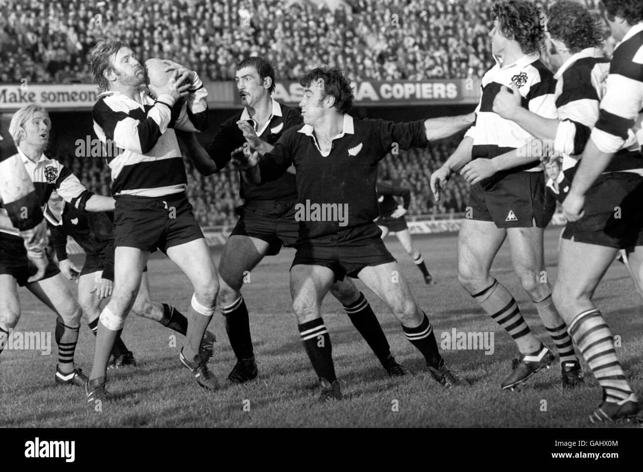 Barbarians' Derek Quinnell (second l) grabs the ball as New Zealand's ...