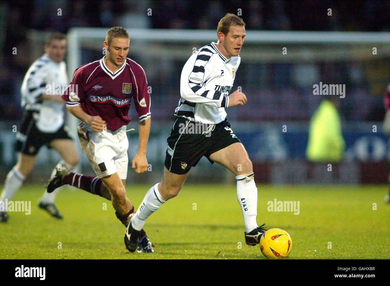 Northampton Town's Chris Carruthers chases down Port Vale's Steve ...