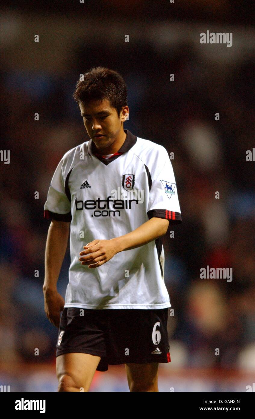 A dejected Junichi Inamoto of Fulham walks off the pitch after losing 3 ...