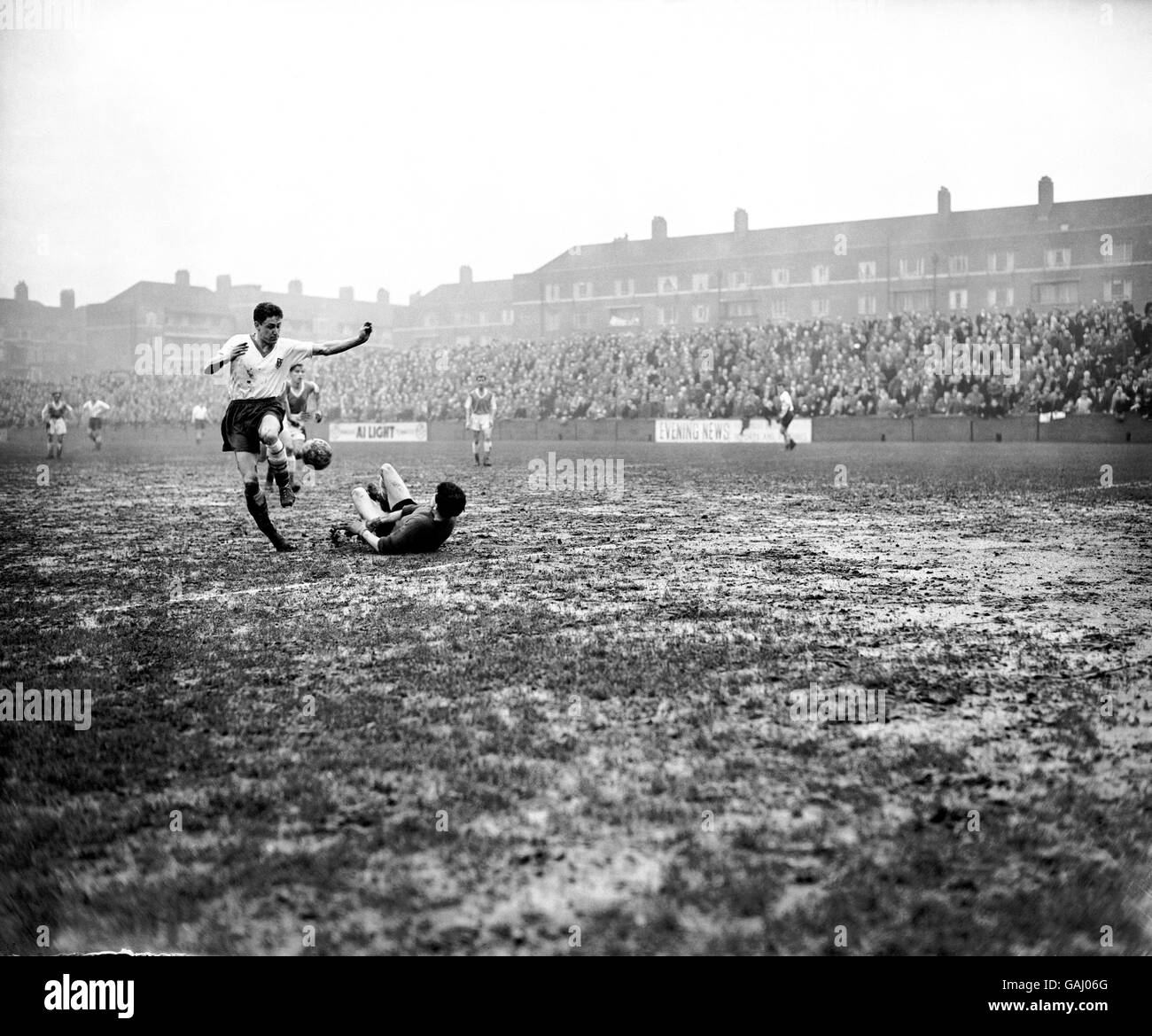 Exeter City goalkeeper George Hunter (r) saves at the feet of Queens ...