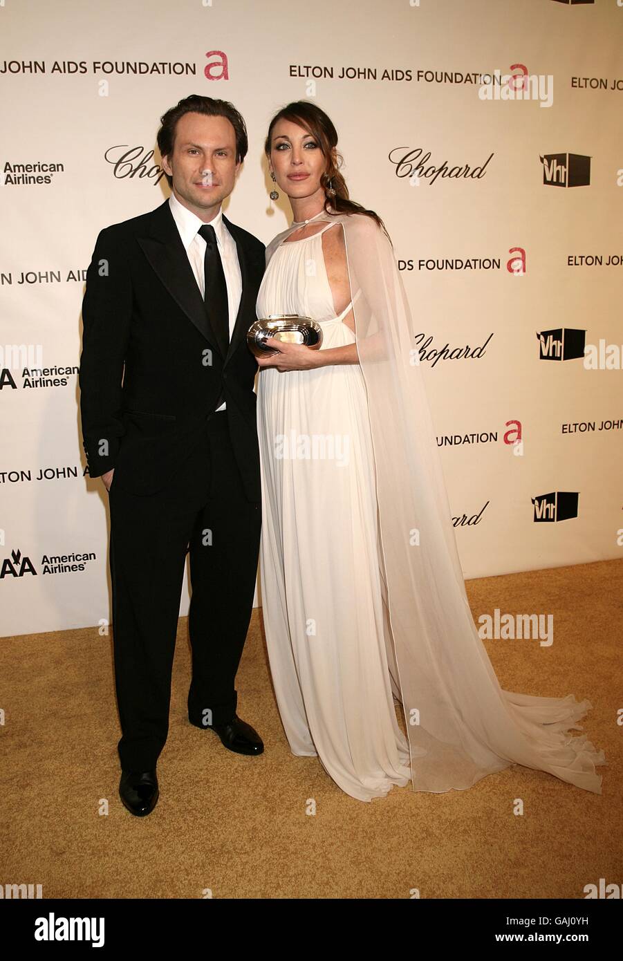 Christian Slater and Tamara Mellon arrive for the 16th Annual Sir Elton ...