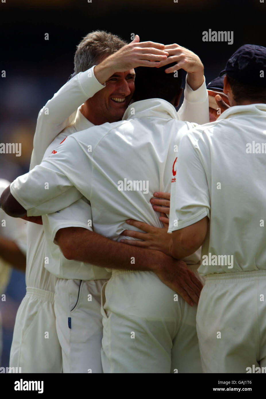 England's Andrew Caddick hugs Alex Tudor after he caught out Australia ...