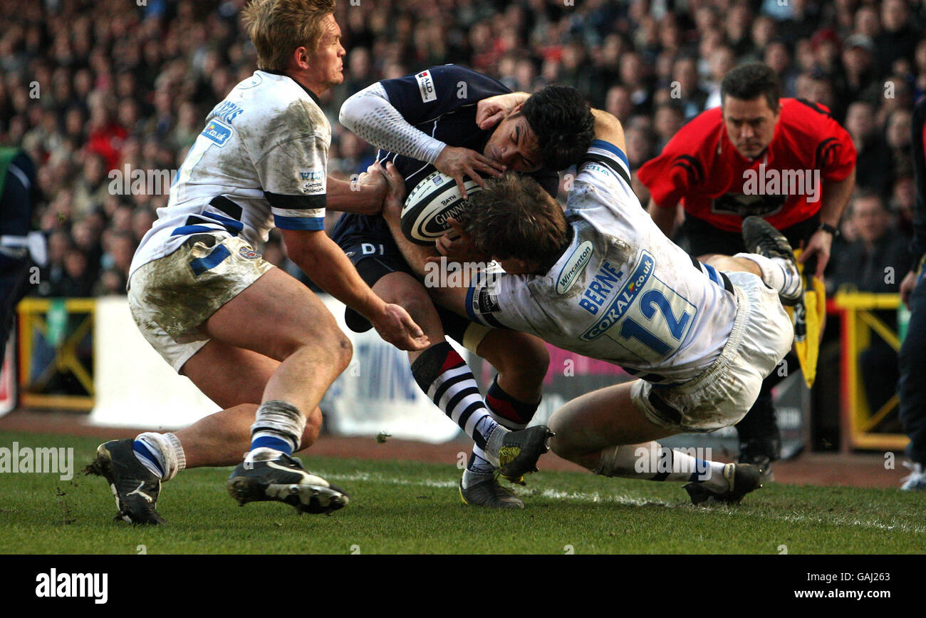 Bristol's David Lemi is hauled in to touch by Bath's Shaun Berne and ...