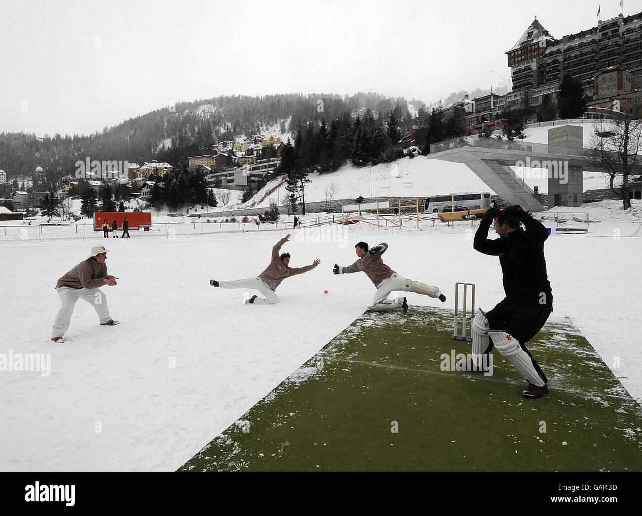 Cricketers play on ice during the round robin tournament which ...