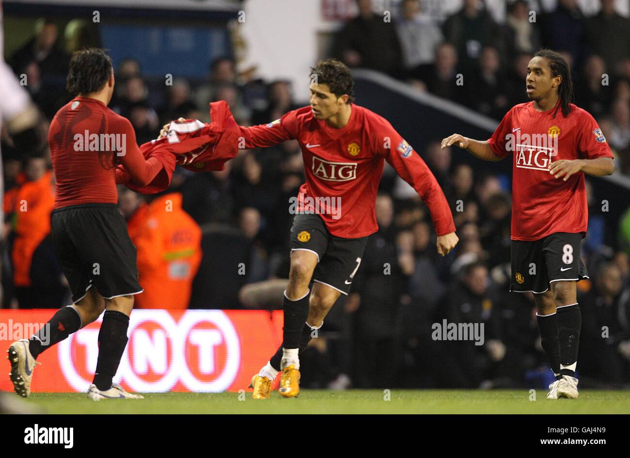 Manchester United's Carlos Tevez gives his shirt to team mate Cristiano ...