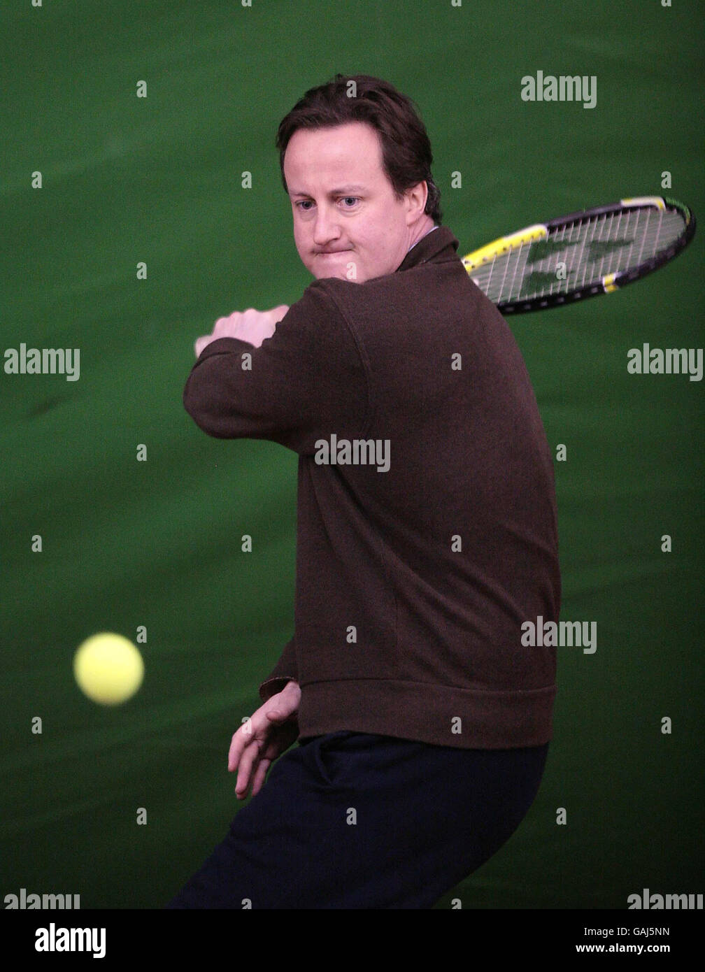Tory leader David Cameron plays tennis during his visit to the FC ...