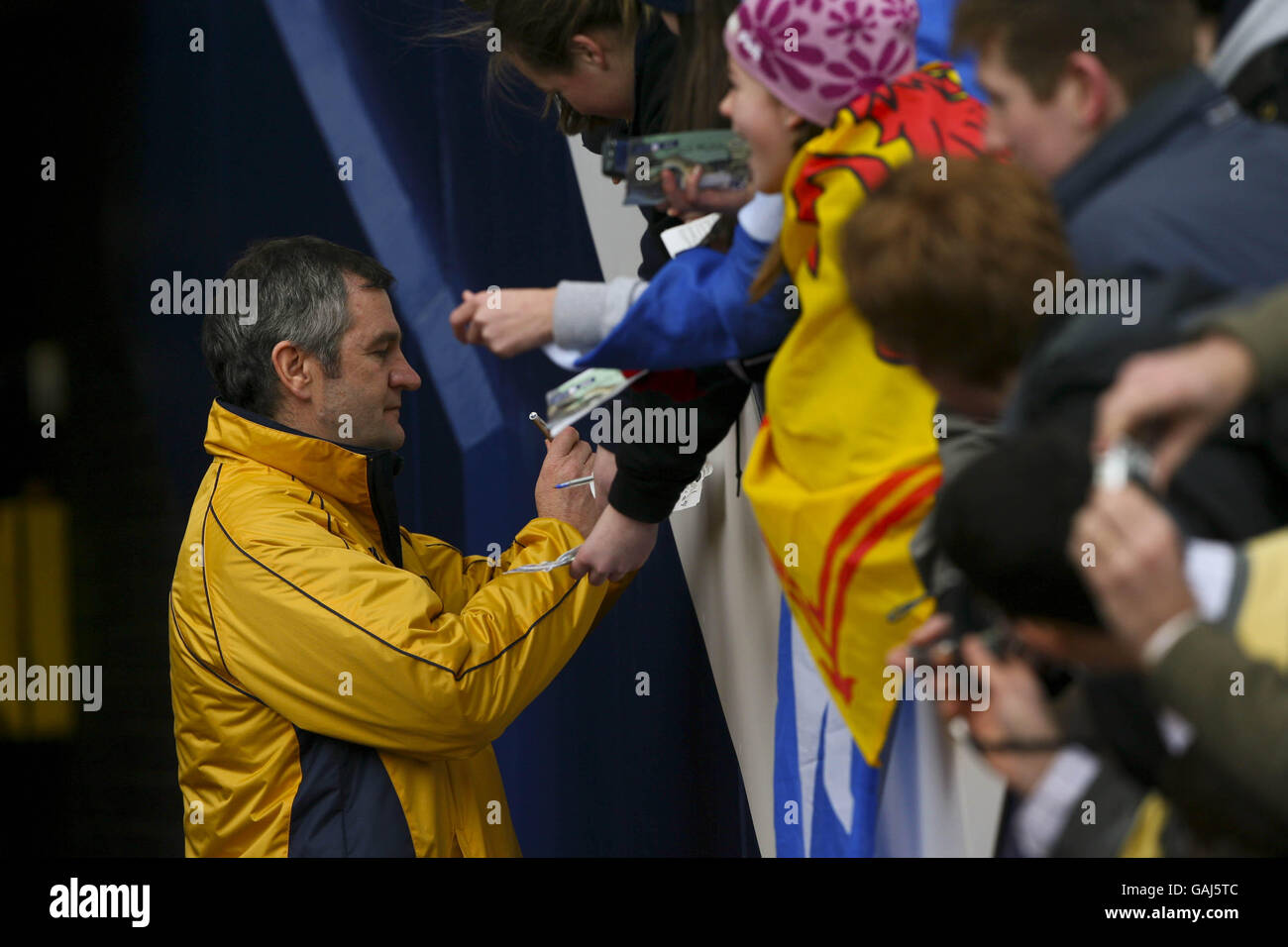 Scotland's head coach Frank Hadden signs autographs for supporters ...