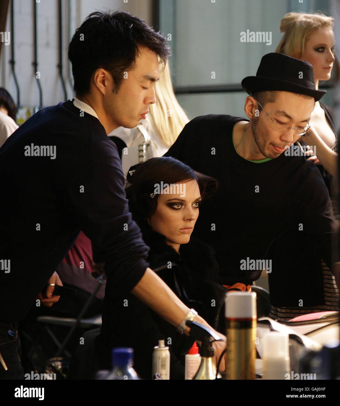 Scenes from the back stage area of the show by designer Ashley Isham ...