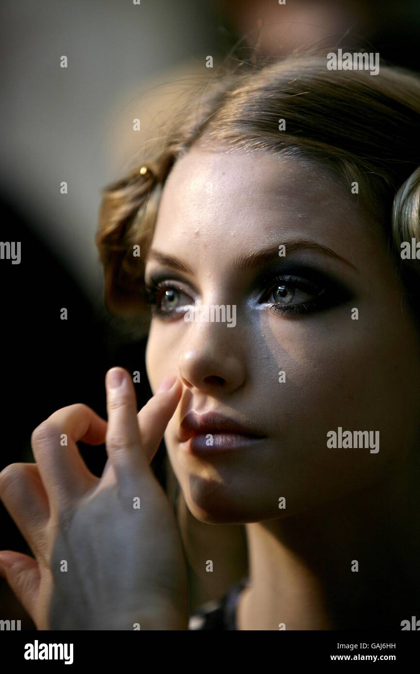 Scenes from the back stage area of the show by designer Ashley Isham ...