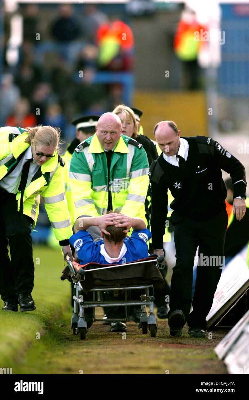 Chesterfields marcus ebdon is stretchered off the pitch hi-res stock ...