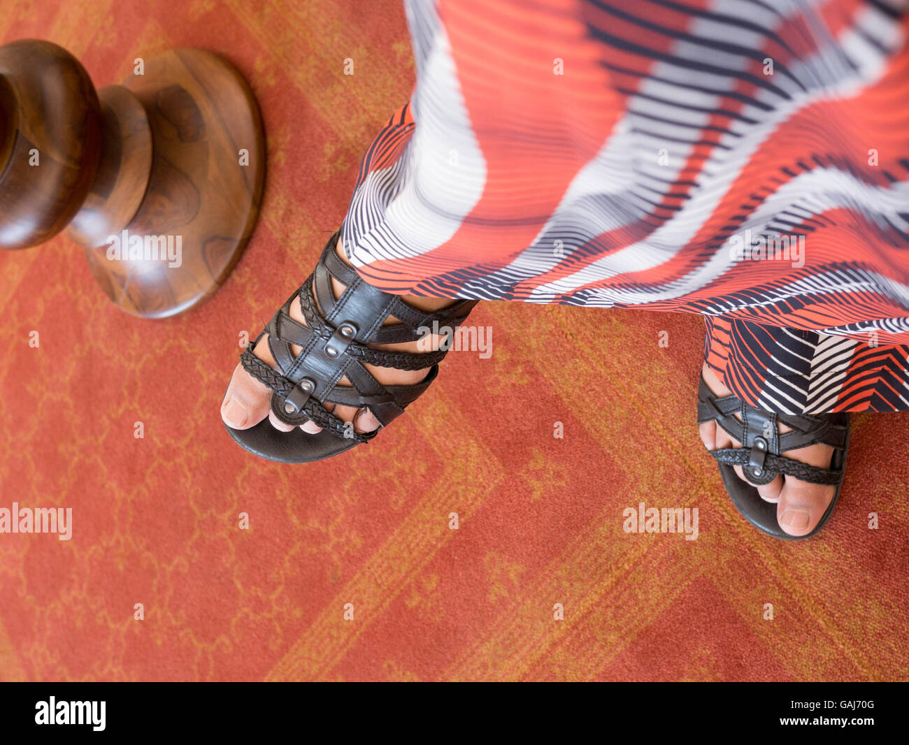 Feet of a woman in sandals on designer red carpet Stock Photo - Alamy