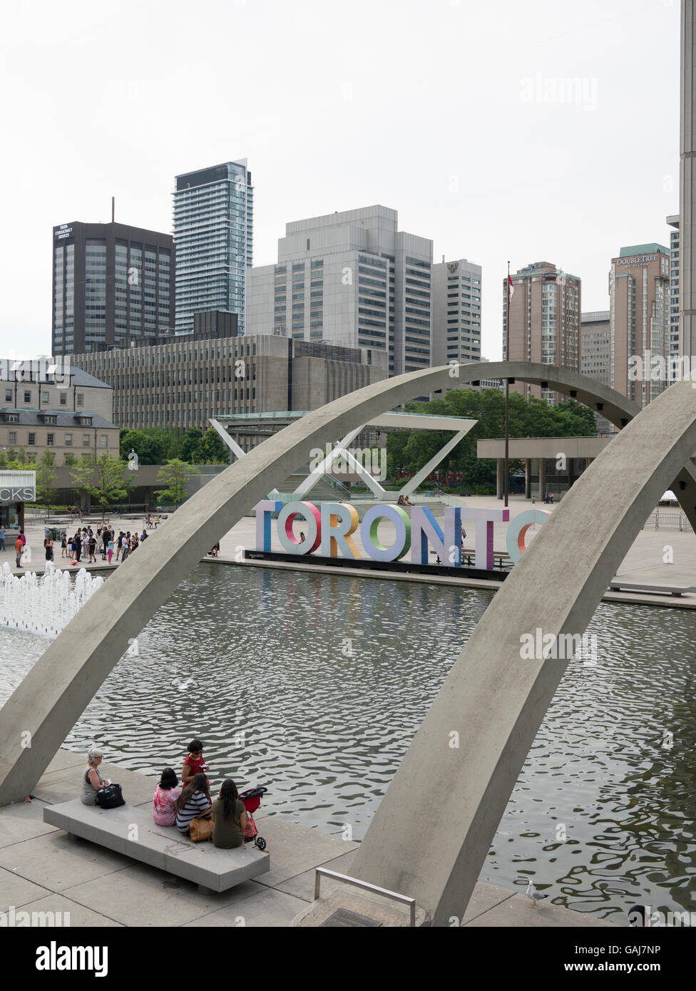 Tourists taking photos in front of Toronto 3D sign in Nathan Phillips ...
