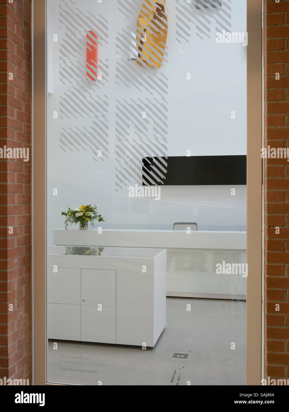White interior space of an office photographed through inscribed glass ...