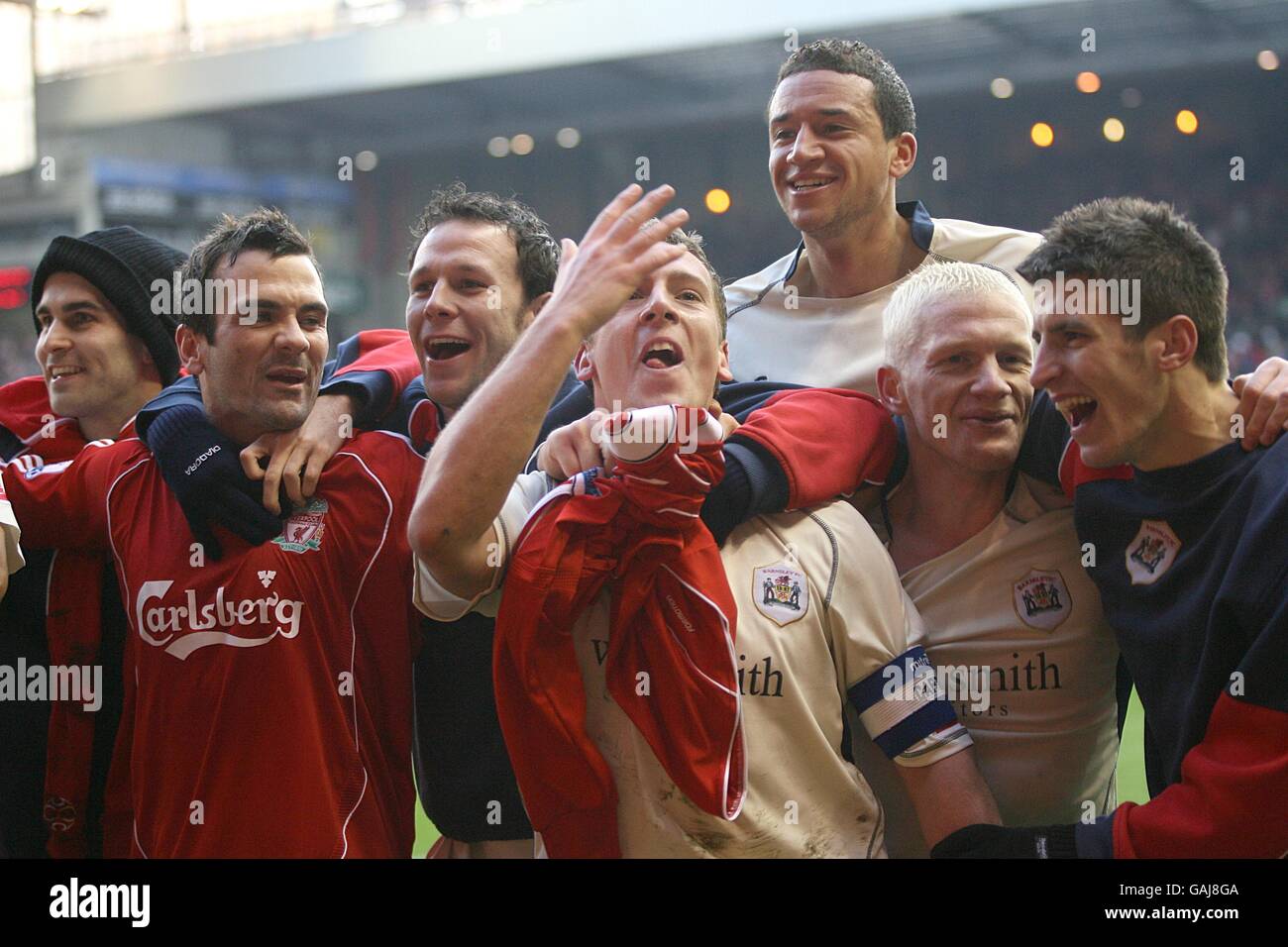 Barnsley's Brian Howard (c) celebrates after the final whistle with his ...
