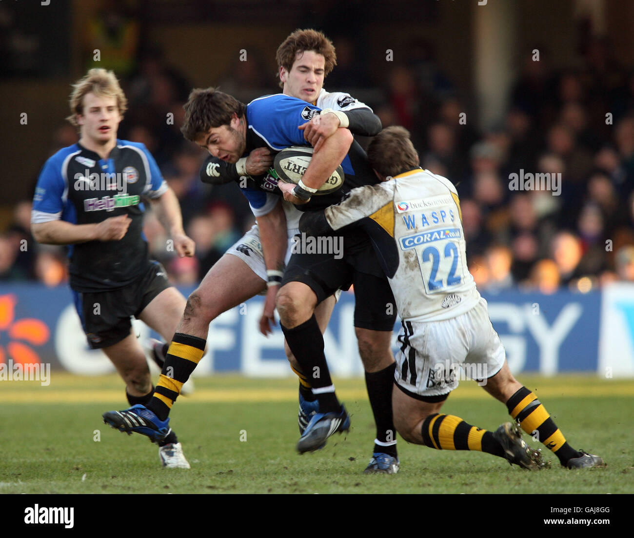 Bath's Matt Banahan is tackled by London Wasps' Danny Cipriani (back ...