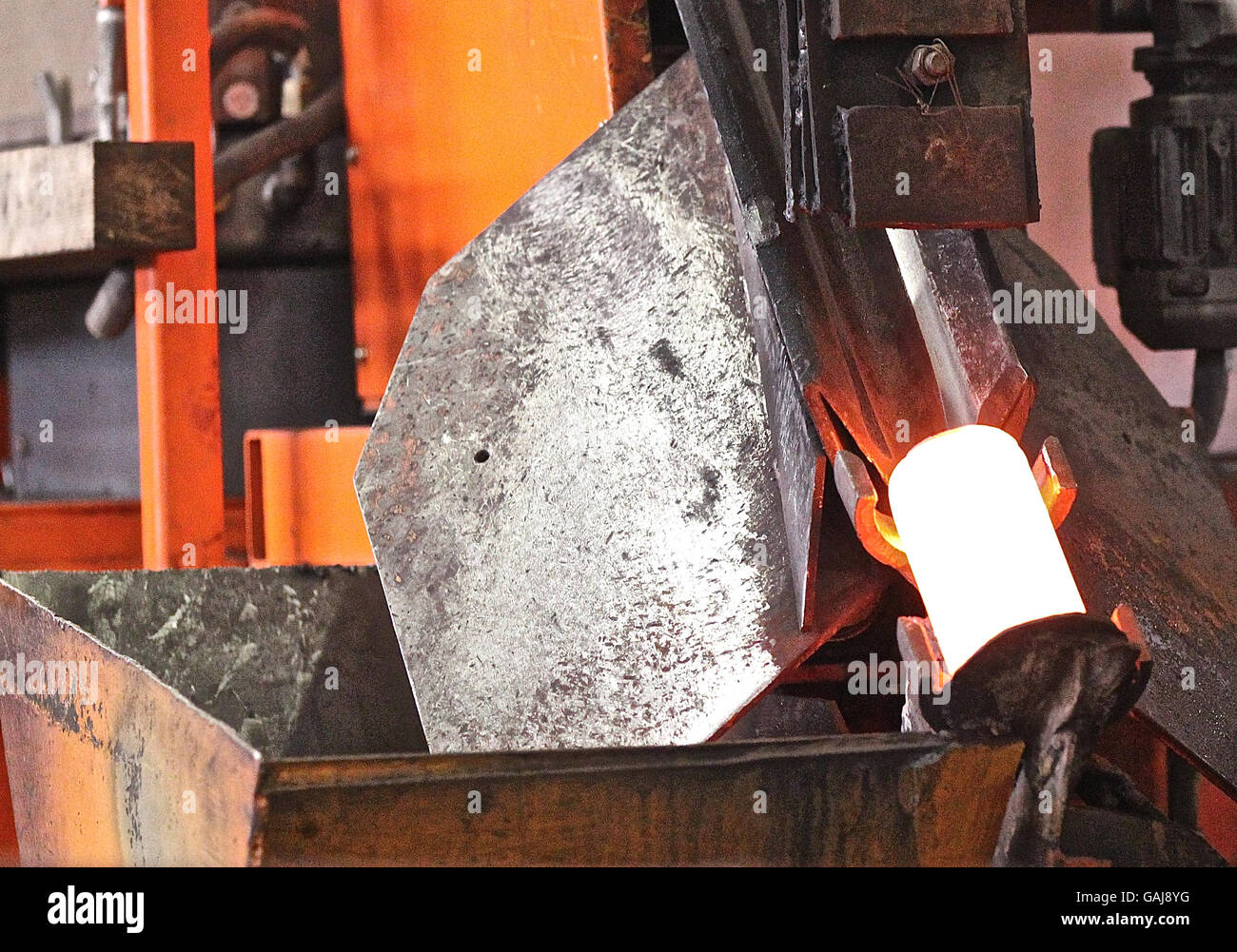 positioning unit and supplying the heated round billet Stock Photo - Alamy