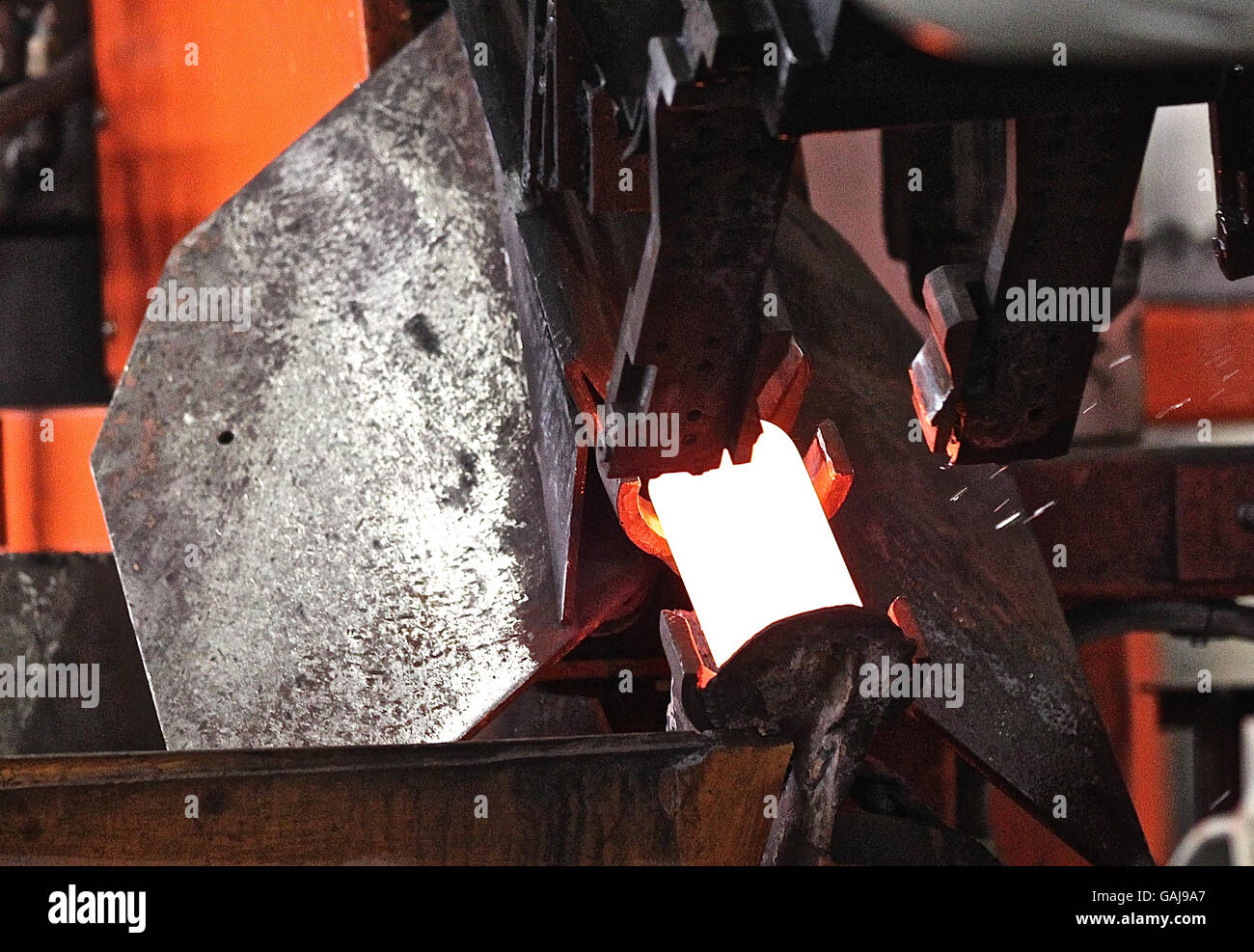 positioning unit and supplying the heated round billet Stock Photo - Alamy