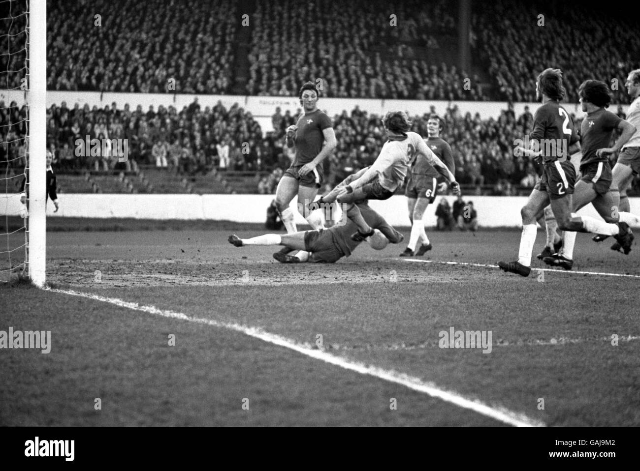 (L-R) Chelsea's Micky Droy watches as goalkeeper John Phillips saves at ...