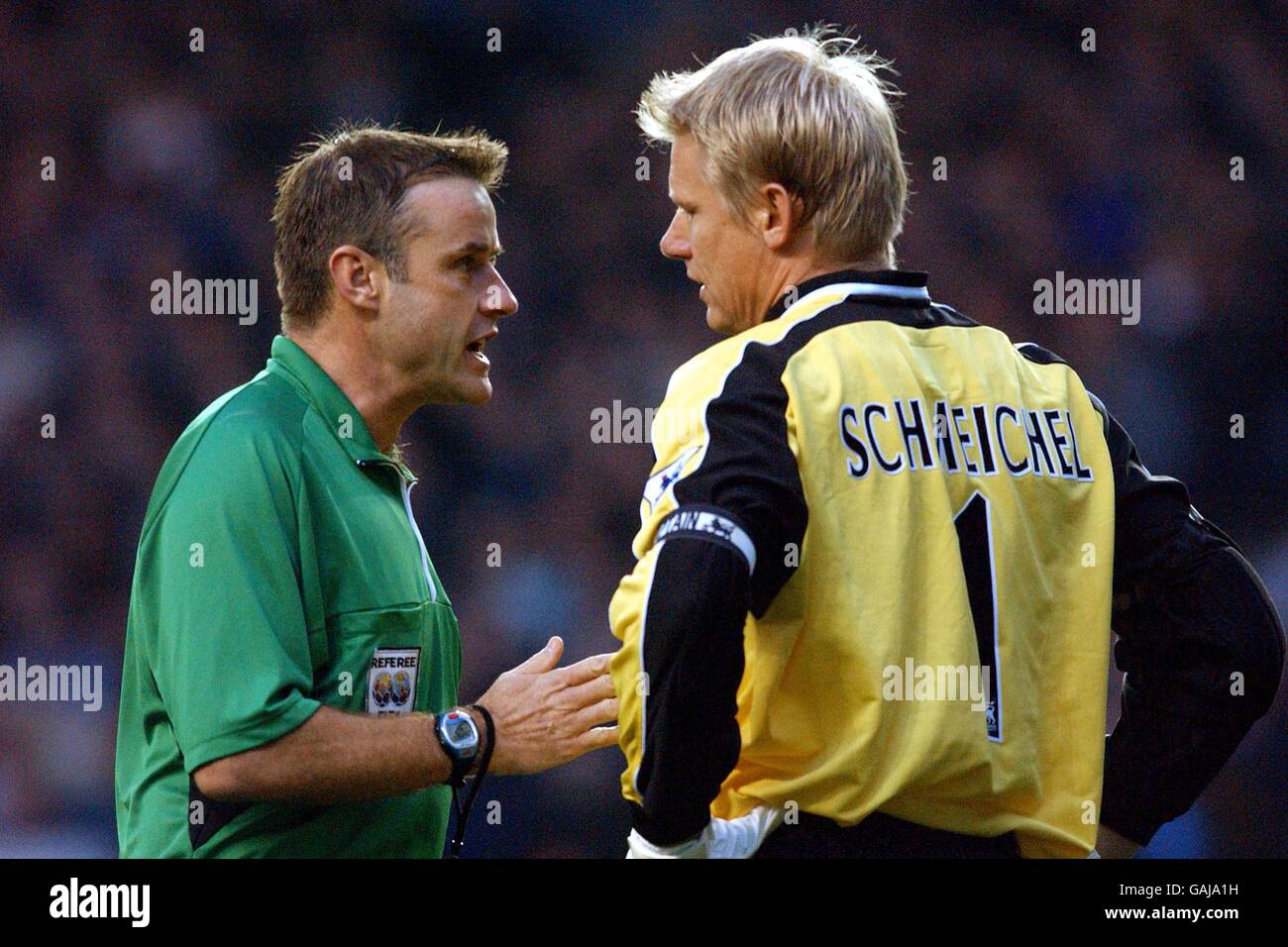 Referee Graham Barber (l) has words with Manchester City's goalkeeper ...