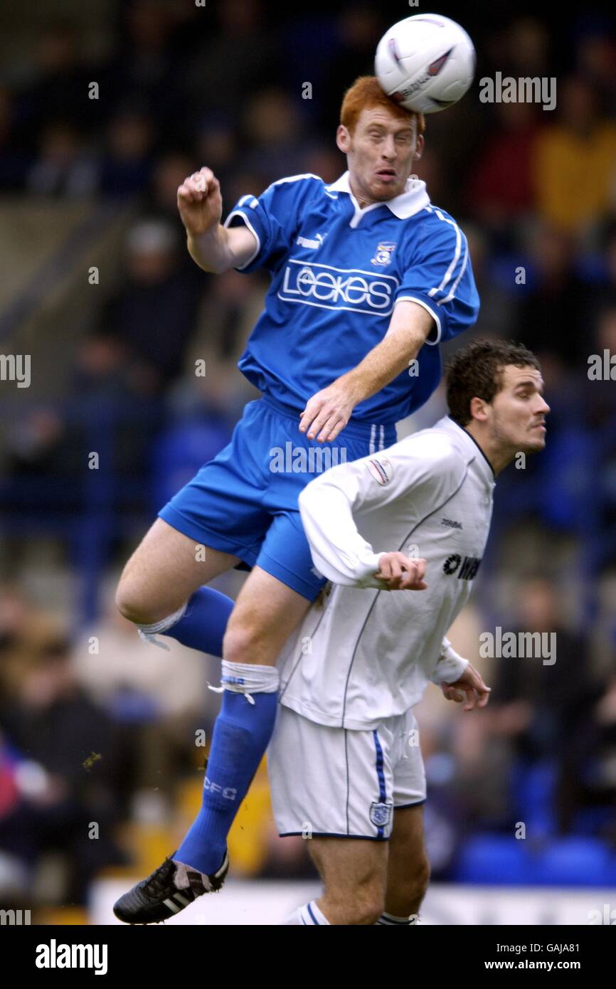 Cardiff City's James Collins (l) wins the header above Tranmere Rovers ...