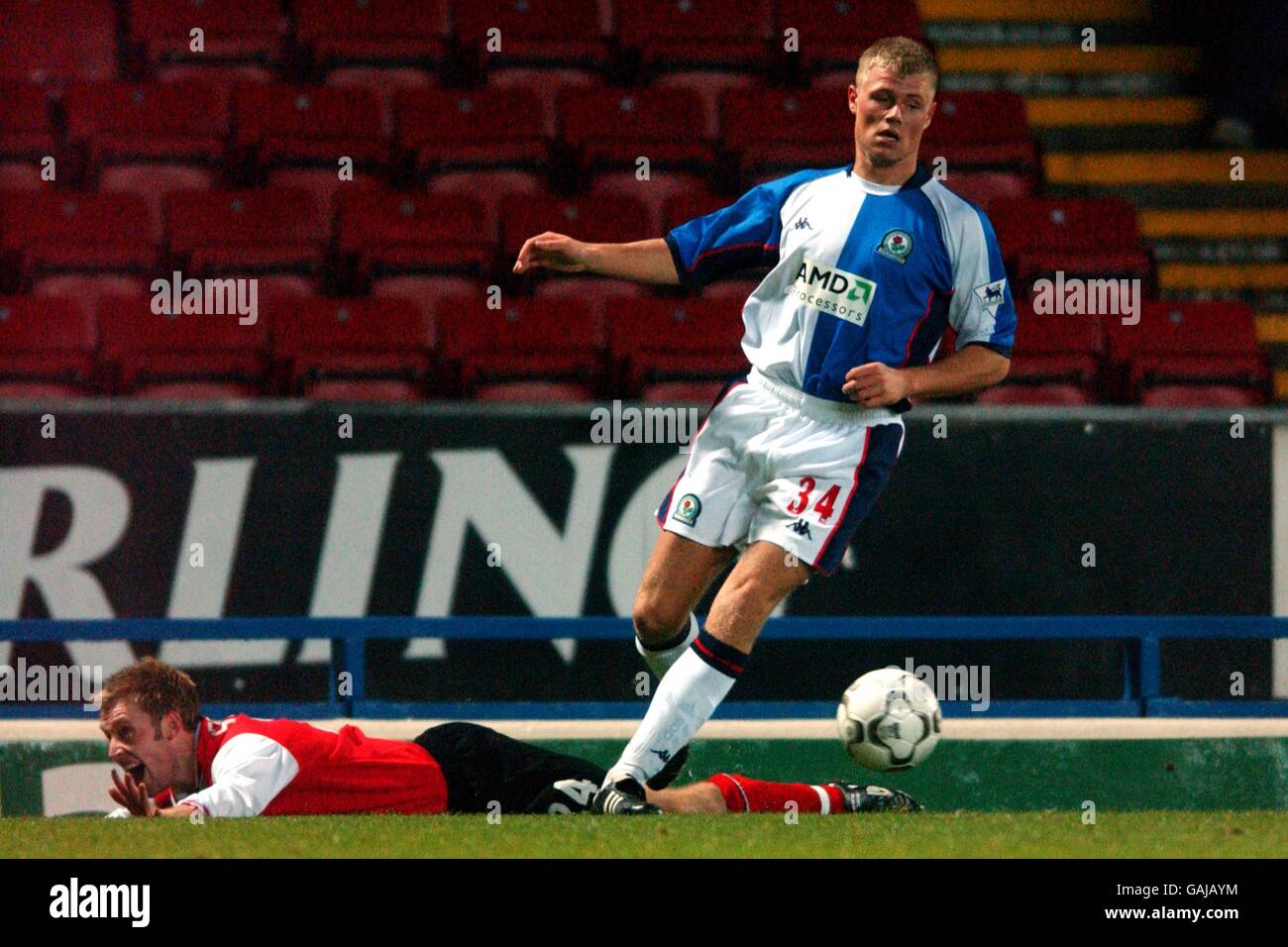 Blackburn Rovers' James McEveley (r) comes away with the ball following ...