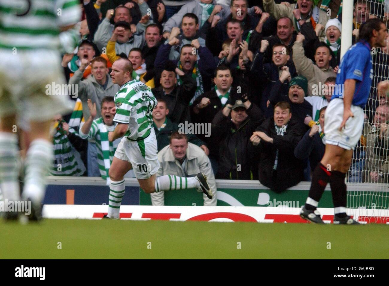 Celtic fans celebrate as John Hartson scores his teams second goal to ...