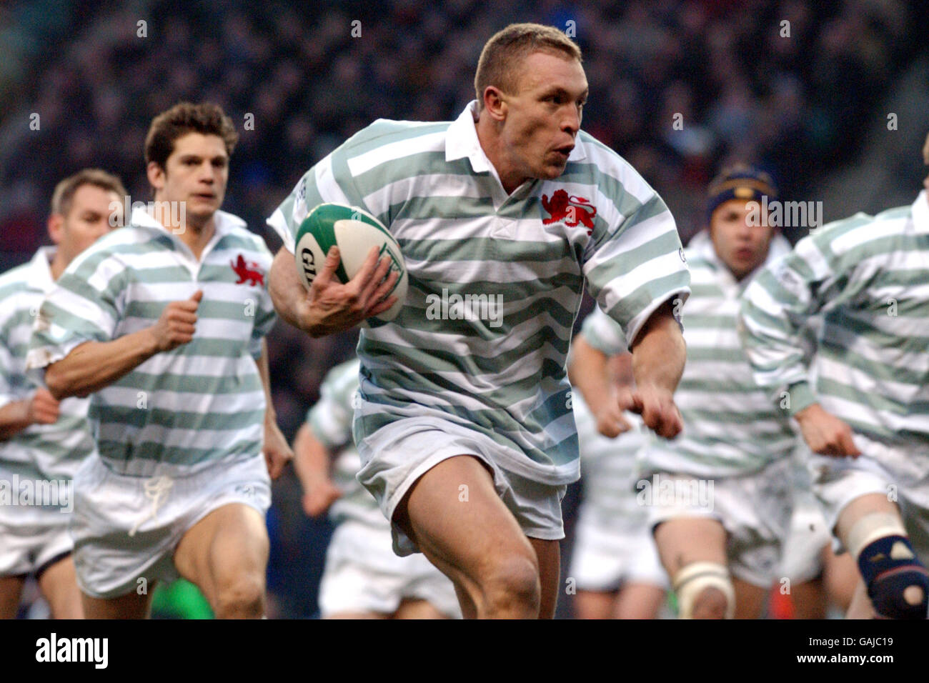 Cambridge University's Simon Frost runs in to score the first try for ...