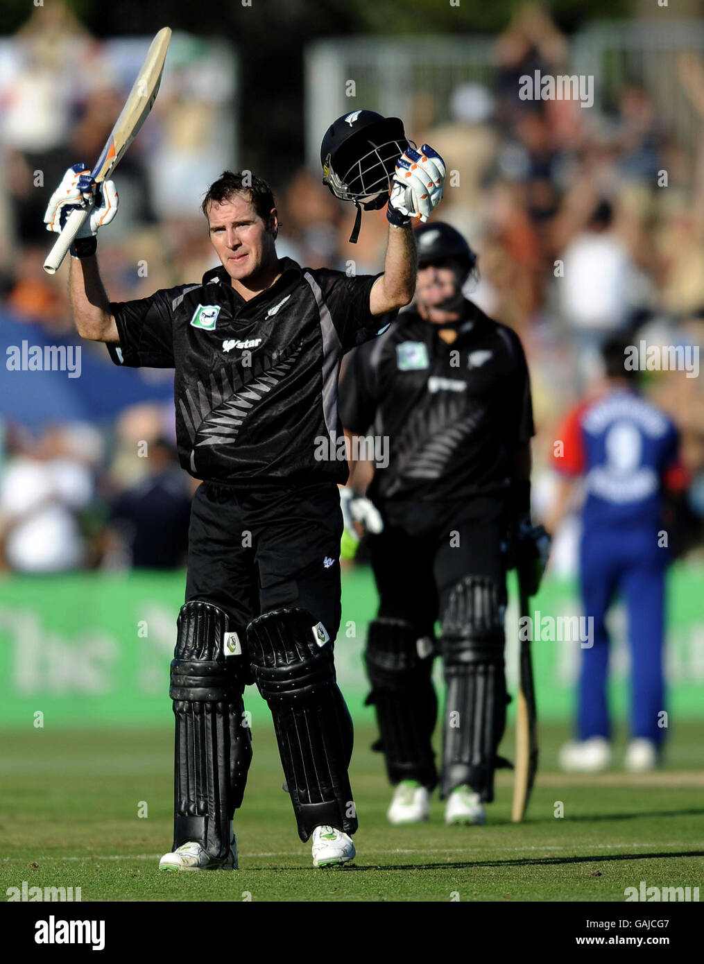 Cricket batsman raising bat hi-res stock photography and images - Alamy