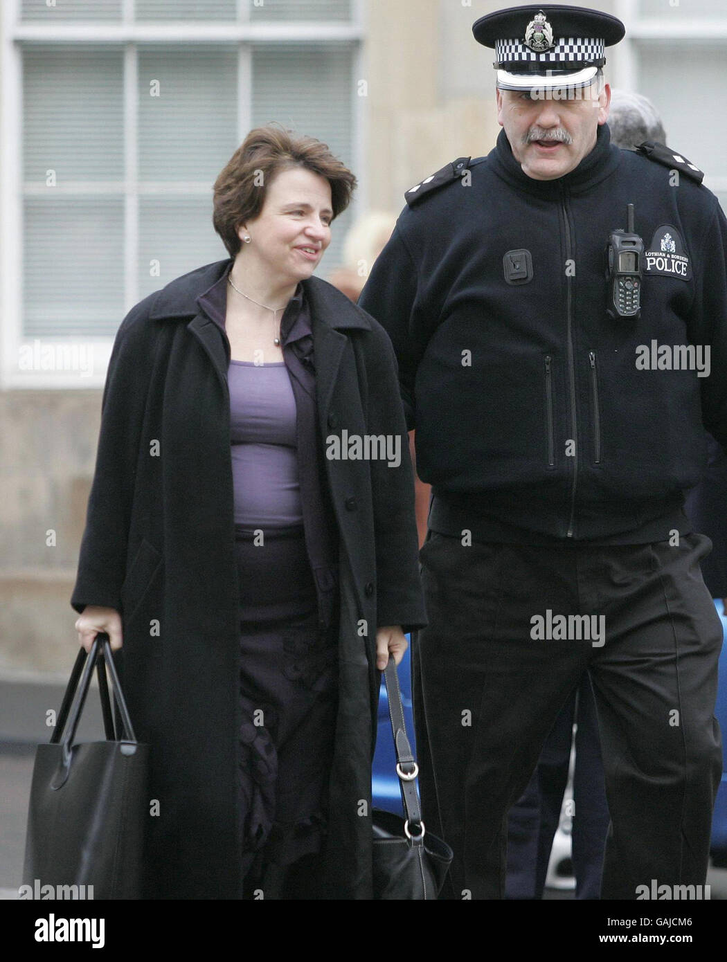 Scottish Labour leader Wendy Alexander speaks to a police officer upon ...