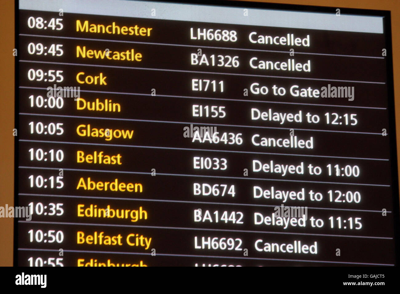 Information boards at Heathrow Airport showing the delayed and ...