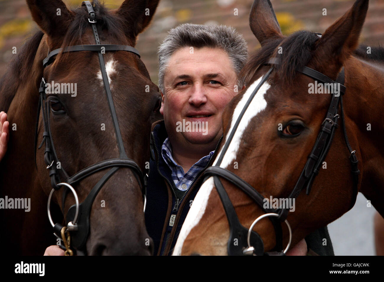 Trainer Paul Nicholls with Denman (left) and Kauto Star (right) at his ...