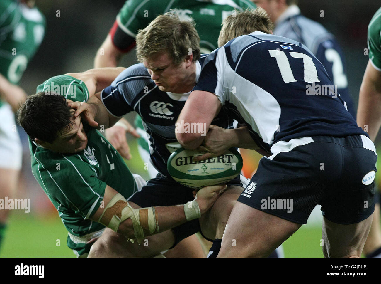Ireland's Paddy Wallace tackling with Scotland's Fergus Thompson and ...