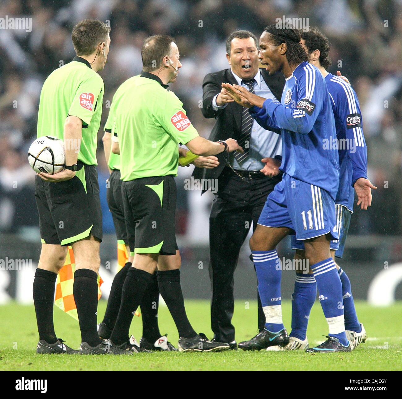 Chelsea coach Henk Ten Cate stops Didier Drogba from talking to referee ...