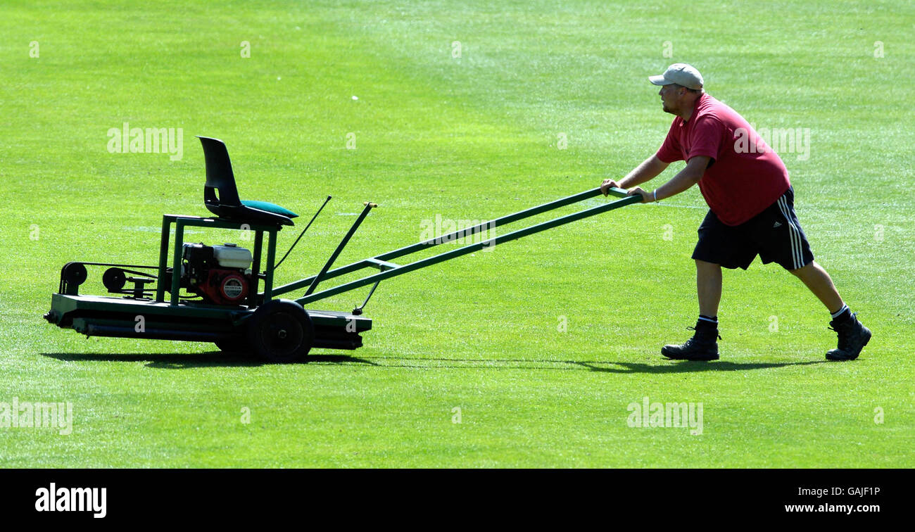A petrol driven roller is bought to the wicket during a change of ...