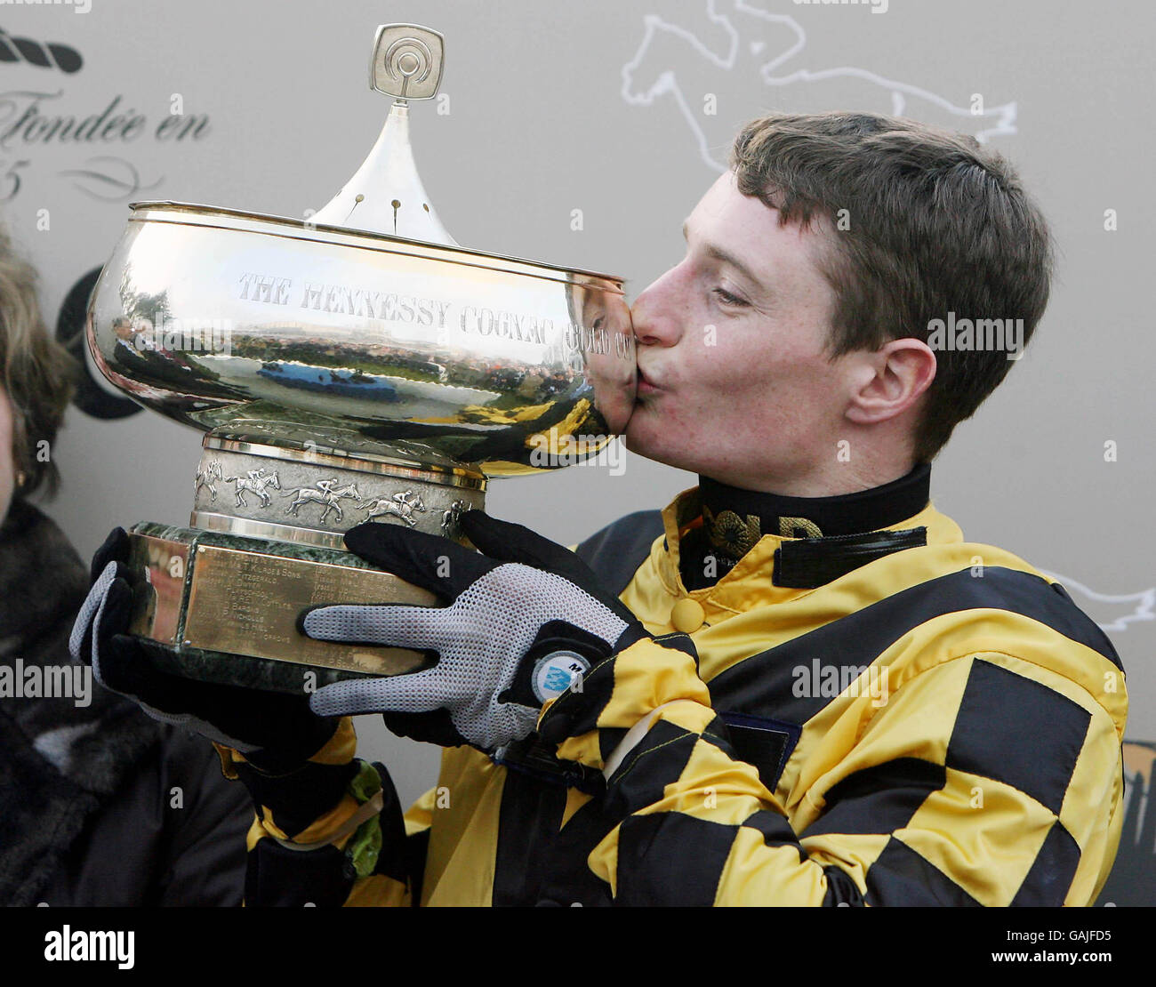 Jockey Daryl Jacob kisses the Hennessy Cognac Gold Cup after taking the ...