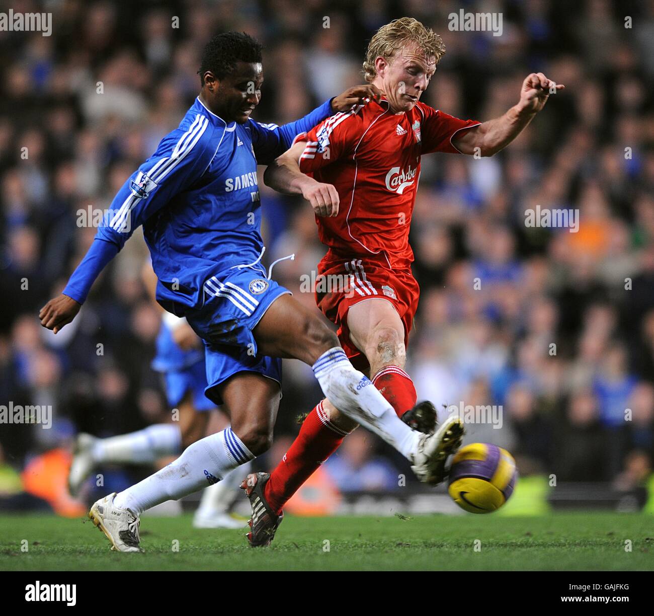Liverpool's Dirk Kuyt (right) and Chelsea's John Mikel Obi battle for ...