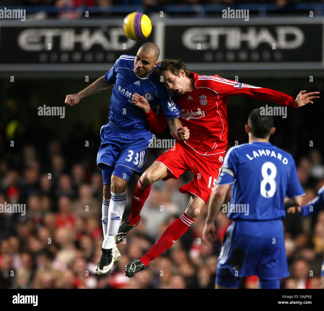 Chelseas alex left liverpools peter crouch battle for the ball hi-res ...