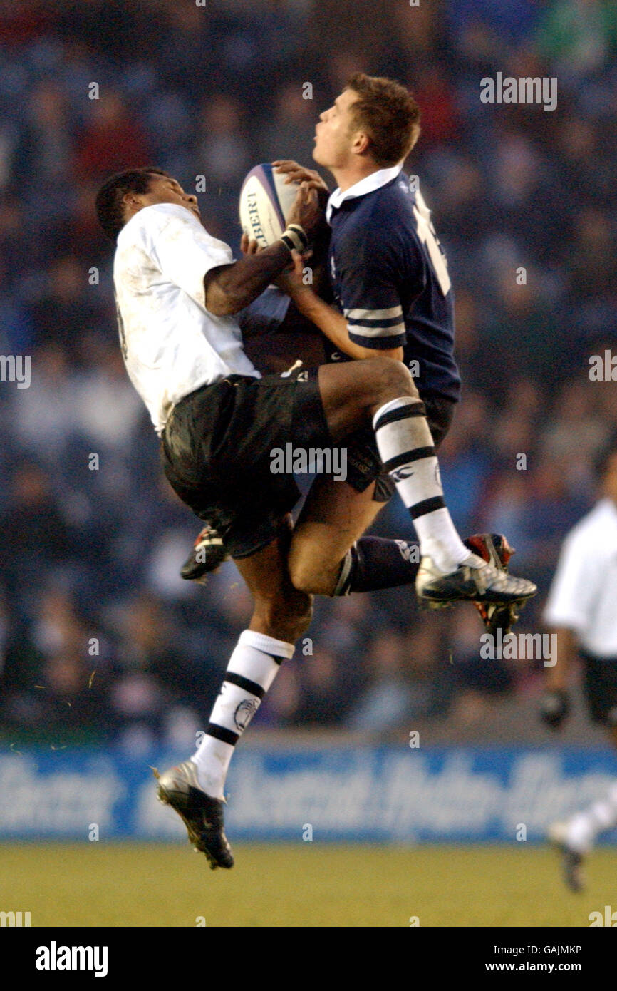 Scotland's Andy Craig jumps with Fiji's Epeli Ruivadra Stock Photo - Alamy
