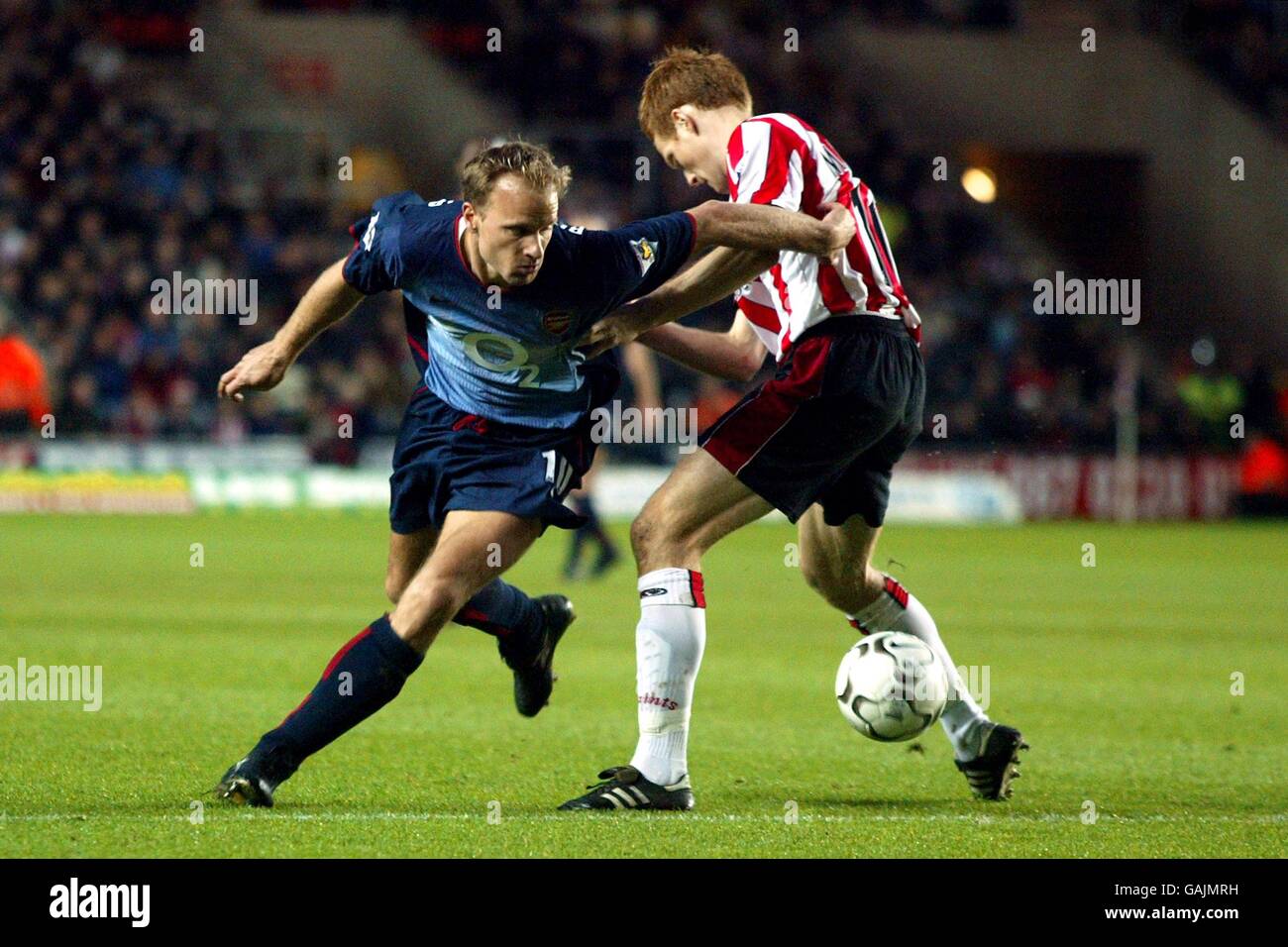 Arsenal's Dennis Bergkamp (l) takes on Southampton's Michael Svensson ...