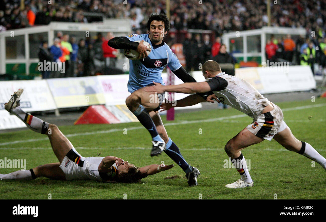 St Helens' Ade Gardner goes past Bradford's Jamie Langley (left) and ...